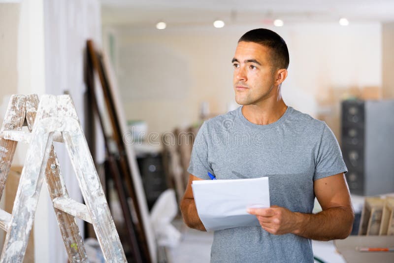 Man Designer Checking Documents during Repair Works Stock Photo - Image ...