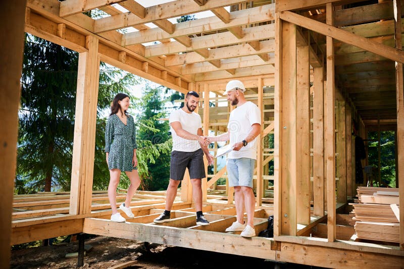 Man Designer with Plan Showing the Process of Constructing Wooden ...