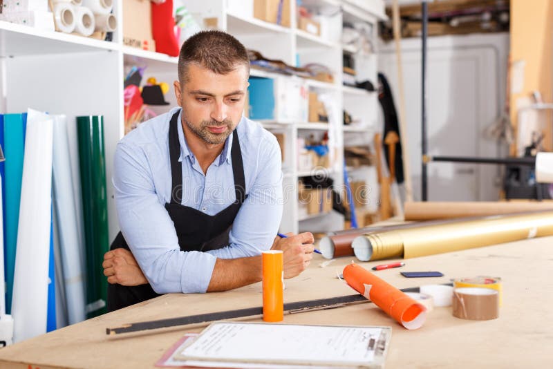 Man Designer and Print Operator with Paper Print at Print Manufacturing ...