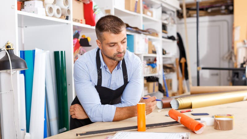 Man Designer and Print Operator with Paper Print at Print Manufacturing ...