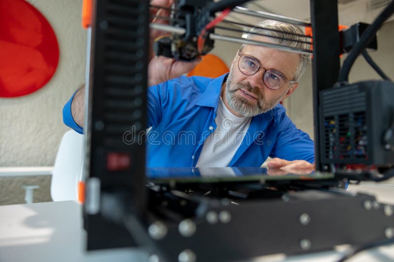 Man Designer Printing Design Using 3D Printer in Office. Stock Photo ...