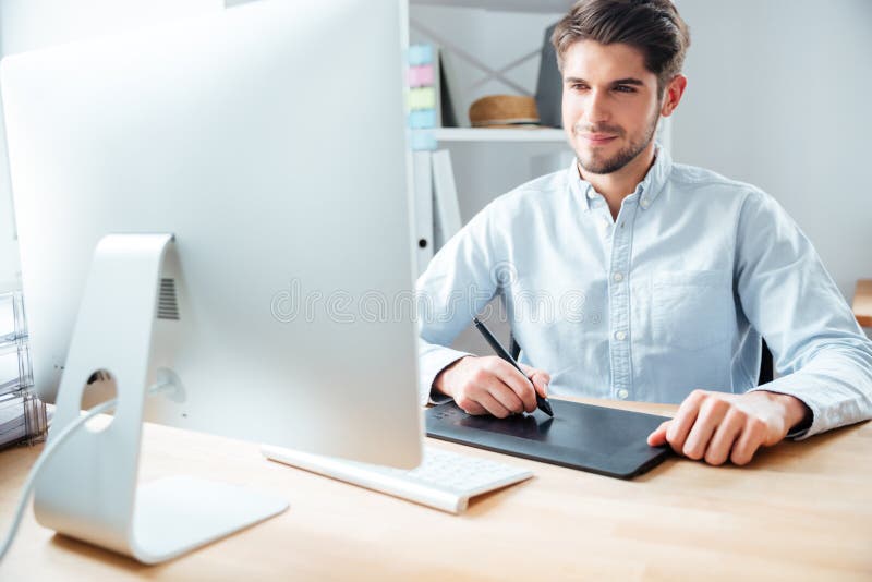 Man Designer Working Using Computer and Graphic Tablet at Workplace ...