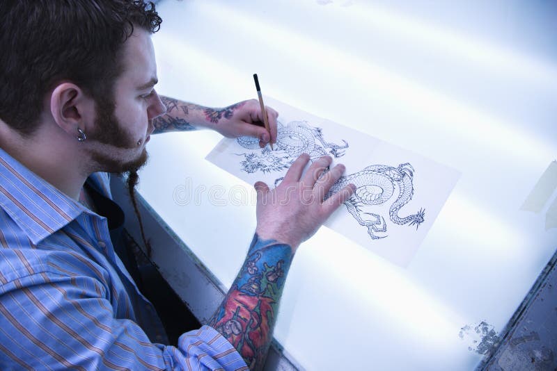 Man drawing tattoo. stock image. Image of design, individuality - 2677987