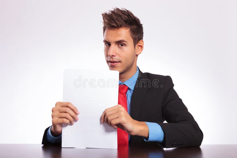 Man at desk looks at you stock image. Image of seated - 29374361