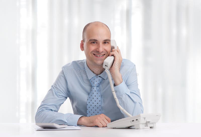 Man at Desk in Office Talking on Phone Stock Photo - Image of telephone ...