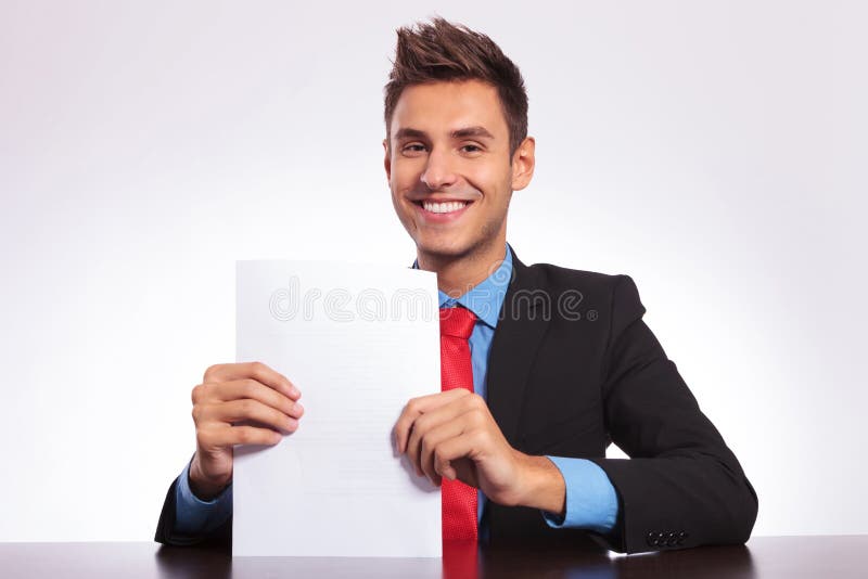 Man at Desk Showing Some Papers Stock Image - Image of books ...