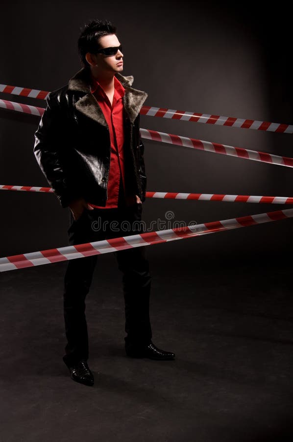 Detective at the Crime Scene. a Man Stands Over the Victim`s Body Stock ...