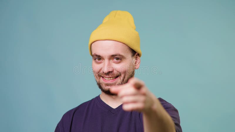 A Man with a Determined Expression, Points at the Camera with His ...