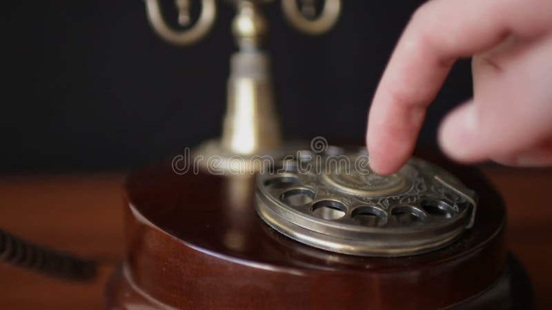 Man Dialing a Number on a Old Style Retro Rotary Telephone Stock ... Man Dialing a Number on a Old Style Retro Rotary Telephone Stock ...