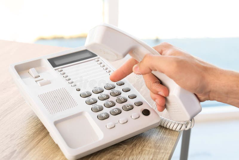 Man Dialing Number on Telephone at Table Stock Photo - Image of ... Man Dialing Number on Telephone at Table Stock Photo - Image of ...