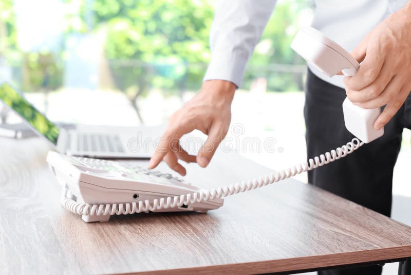 Man Dialing Number on Telephone Stock Image - Image of keypad, adult ...