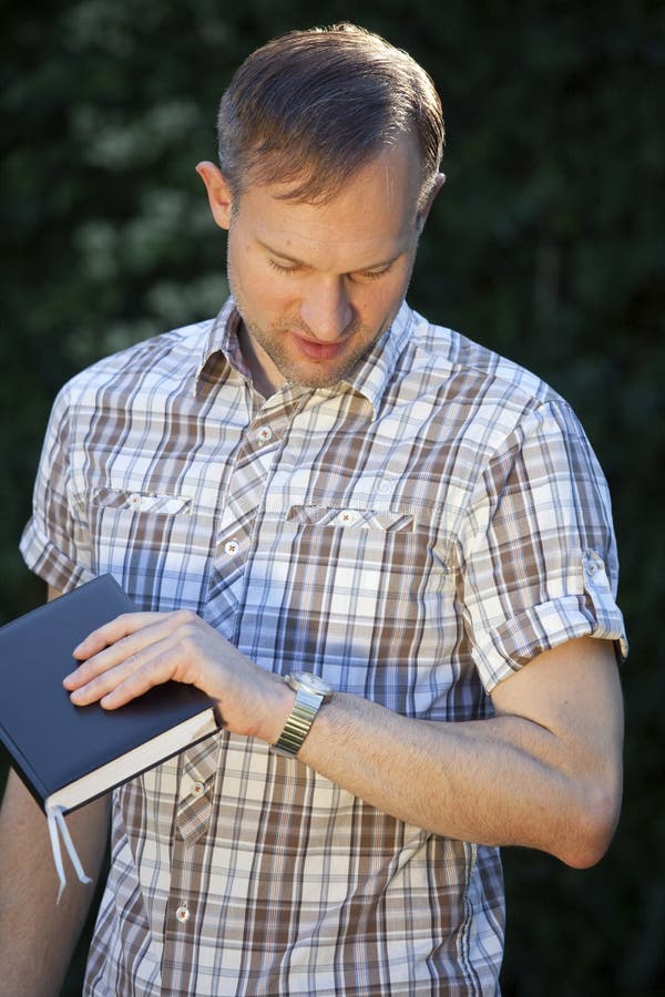 Man with Diary Looking at Watch Stock Image - Image of book, male: 10386651