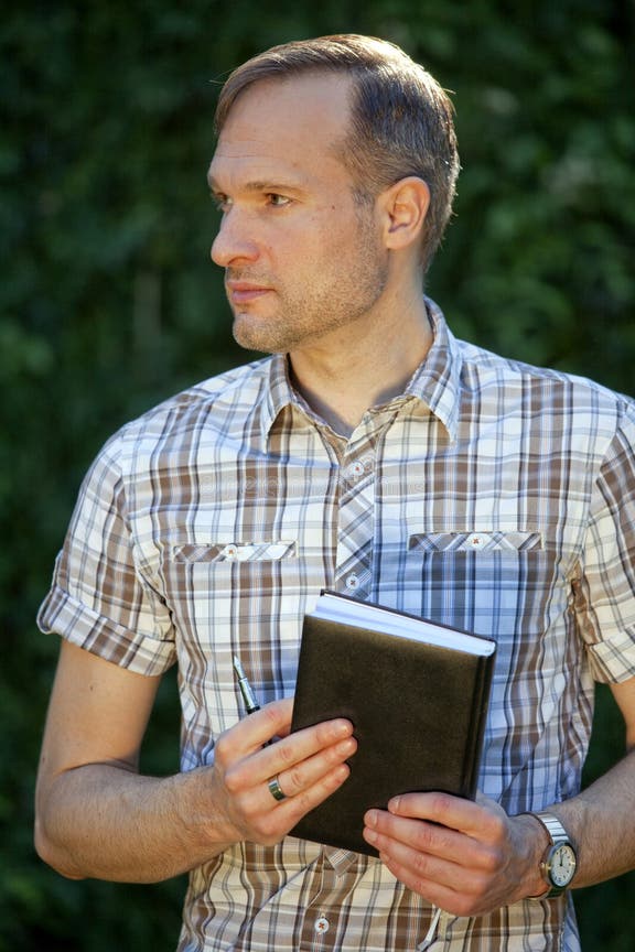Man with diary outdoor stock image. Image of advice, holding - 10450237