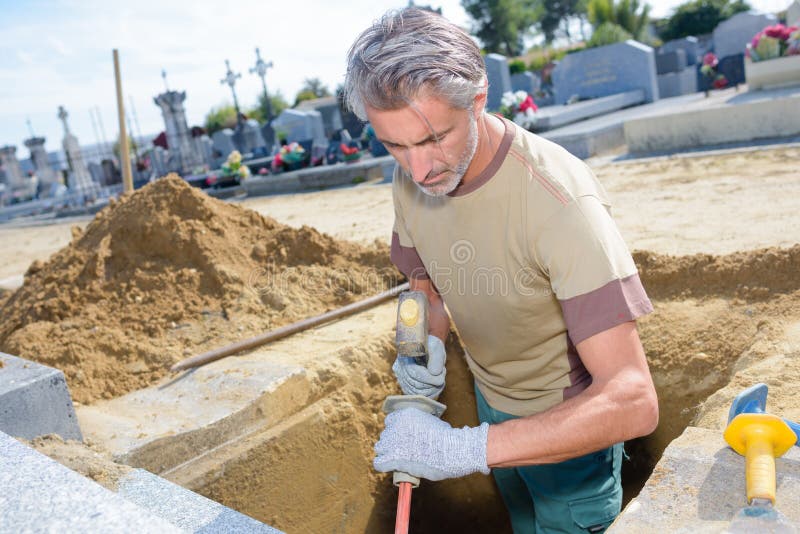 Man digging a grave stock photo. Image of employment - 122433784