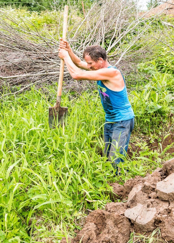 Man digging the ground. stock photo. Image of hole, construction - 69480872