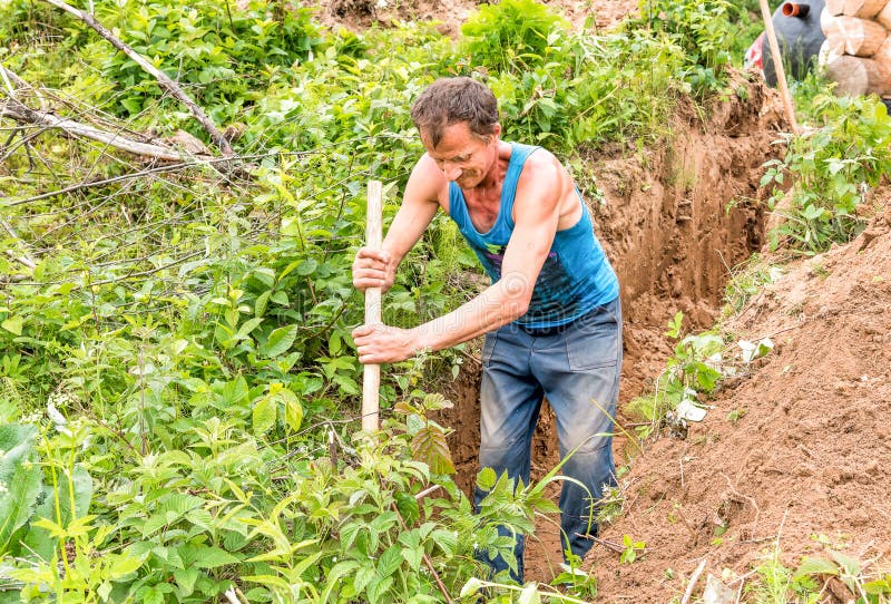 Man digging the ground. stock photo. Image of agriculture - 69481222