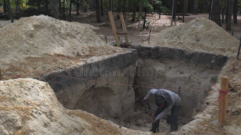 Man digging a hole stock footage. Video of brick, throw - 302308624