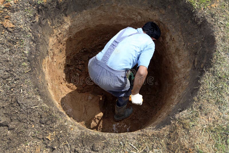 A man digging a new well editorial image. Image of clay - 78870405