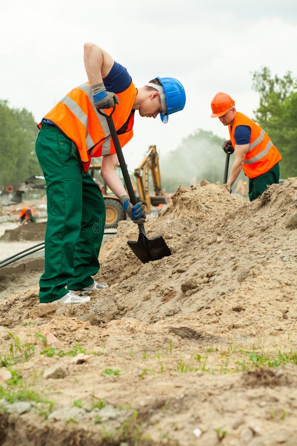 Man Digging at Road Construction Stock Image - Image of asphalt ...