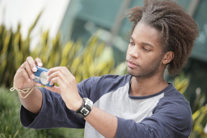 Man with a digital camera stock image. Image of hair - 17077243