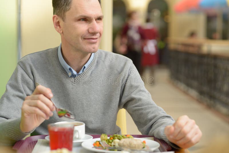 Man eating dinner stock photo. Image of indoors, eating - 7809232