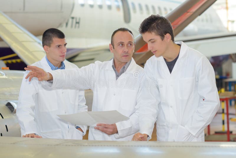 Man Directing Junior Workers Stock Photo - Image of aircraft, service ...