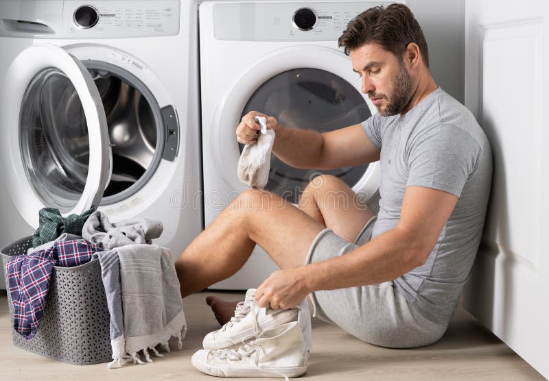Man with Dirty Laundry Front of Washing Machine. Stock Image - Image of ...