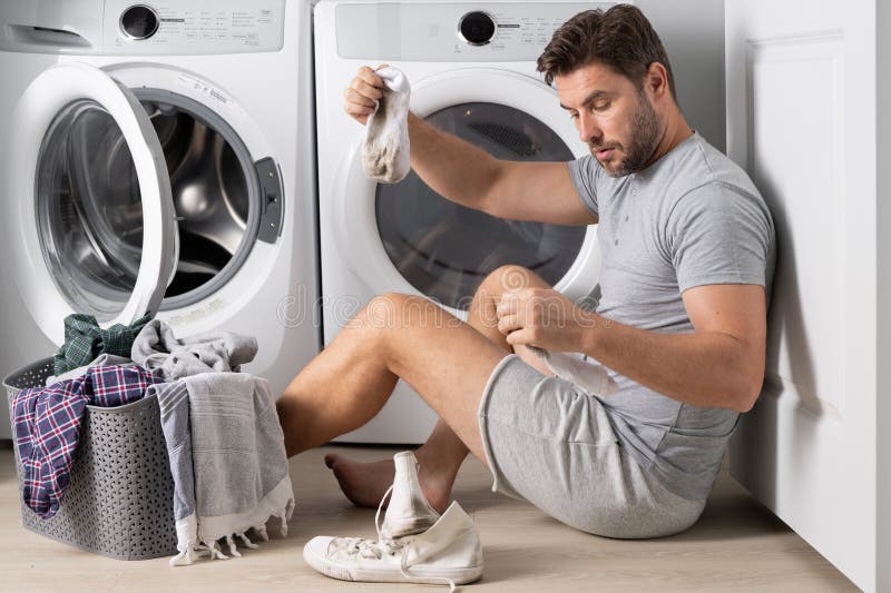 Man with Dirty Laundry Front of Washing Machine. Stock Photo - Image of ...