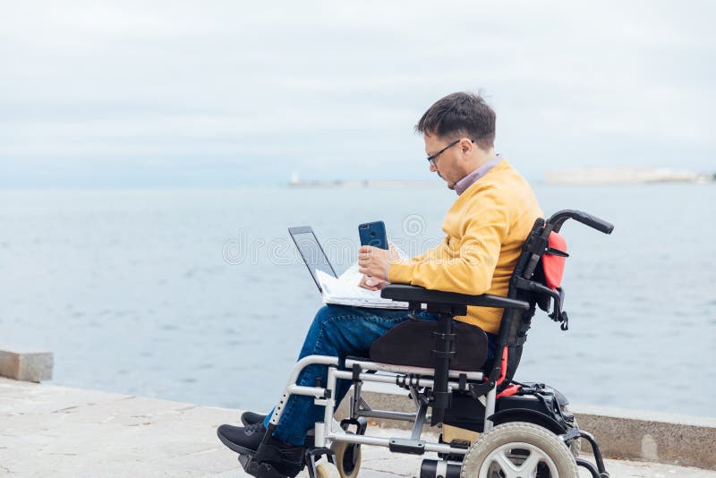 A Man with a Disability in a Disabled Working Business Remotely Stock ...