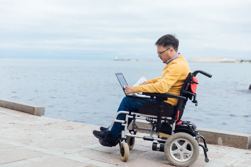 A Man with a Disability in a Disabled Working Business Remotely Stock ...