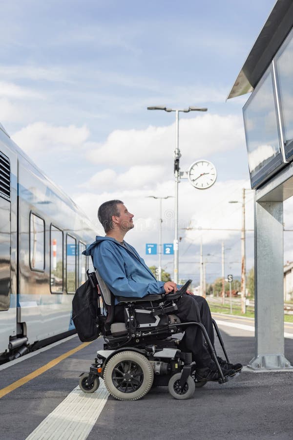 Man with Disability Looking at Train Timetable. Stock Photo - Image of ...