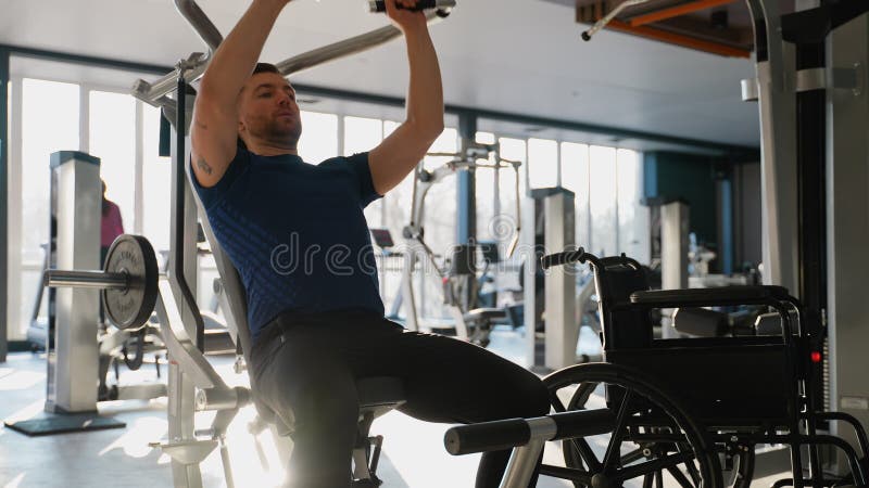 Man with Disability Training Back Muscles on Lat Pulldown Machine Stock ...