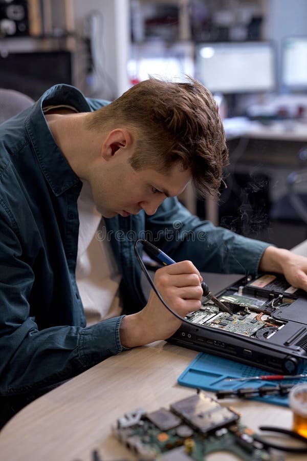 Man Disassembles Broken Laptop. Computer Service and Repair Concept ...