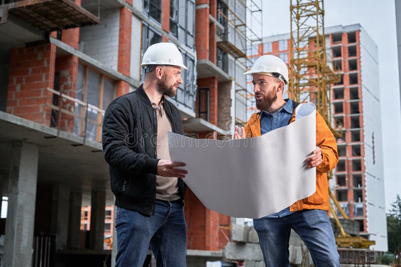 Man Discussing Building Plan with Architect at Construction Site. Stock ...