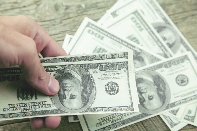 Man Displaying a Spread of Cash Stock Photo - Image of holding, hand ...