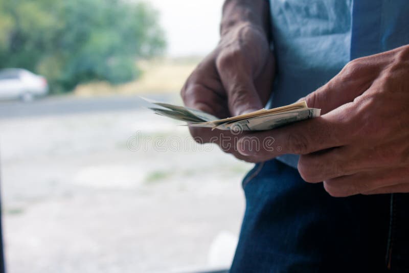 Man Displaying a Spread of Cash Stock Photo - Image of holding, hand ...