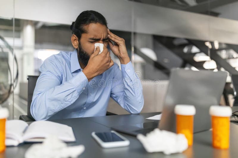 Man in Distress with Hand on Forehead at Desk Stock Photo - Image of ...