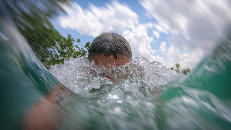 Man Diving at the Beach. Splash in the Water Stock Image - Image of ...