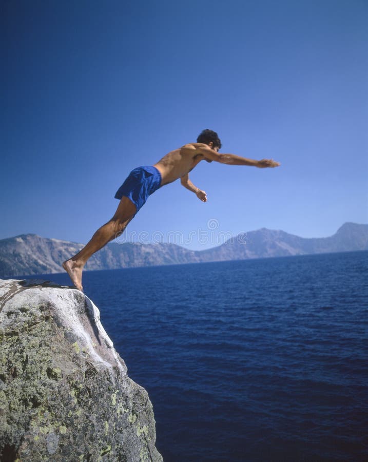 Man diving into lake stock image. Image of swimsuit, lake - 7379647