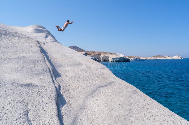 Man Diving at Sarakiniko Beach, Milos, Greece Editorial Photo - Image ...