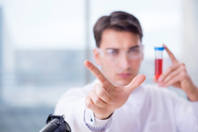 The Man Doctor Checking Blood Samples in Lab Stock Image - Image of ...