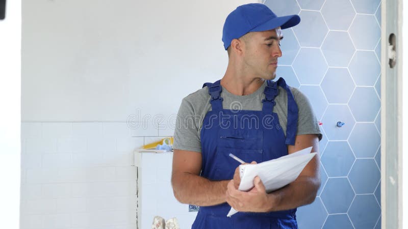 Man with Documents Planning Renovation Works in New Apartment Stock ... Man with Documents Planning Renovation Works in New Apartment Stock ...
