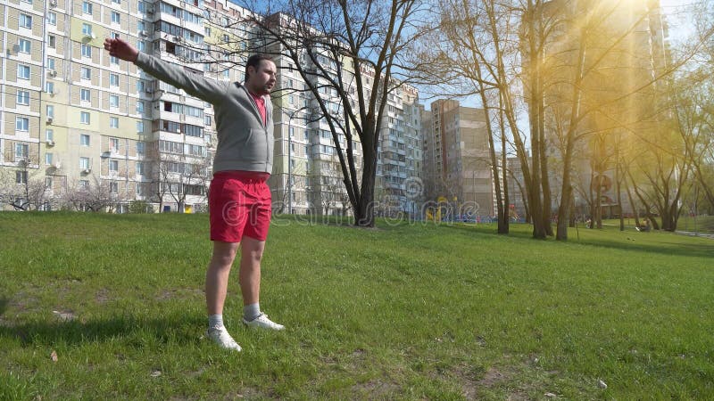 Man Does Physical Exercise on Grass in Park Stock Video - Video of ...