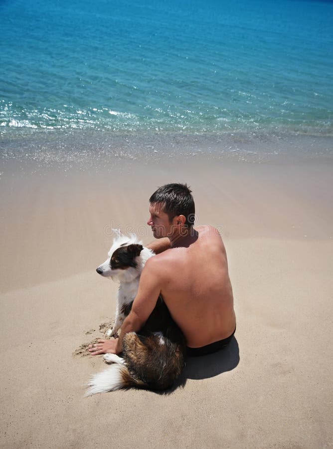 Man and dog stock image. Image of sand, water, together - 19201067