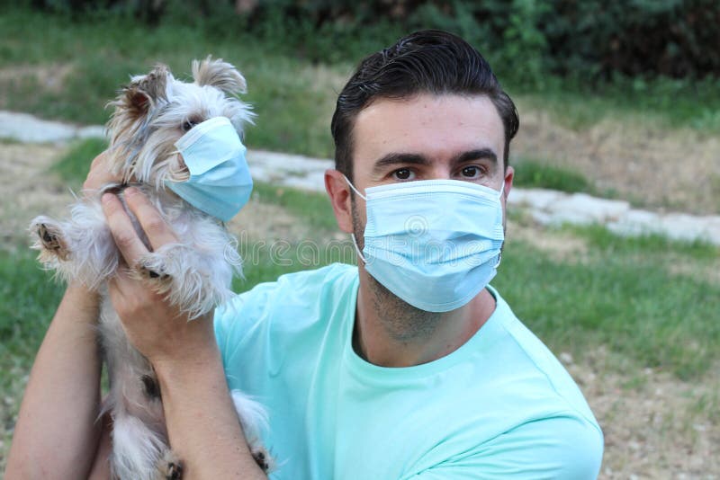 Man and Dog Both Wearing Blue Surgical Masks Stock Image - Image of ...