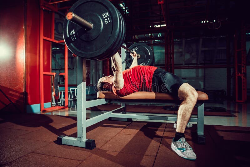 Man Doing Bench Press Workout in Gym Stock Photo - Image of barbell ...