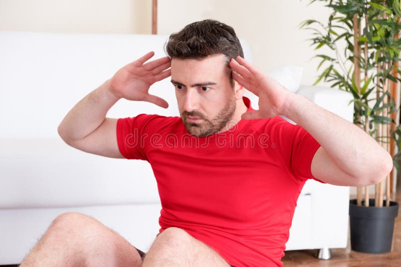 Athletic Young Man Doing Curl Ups Exercise at Home Stock Photo - Image ...
