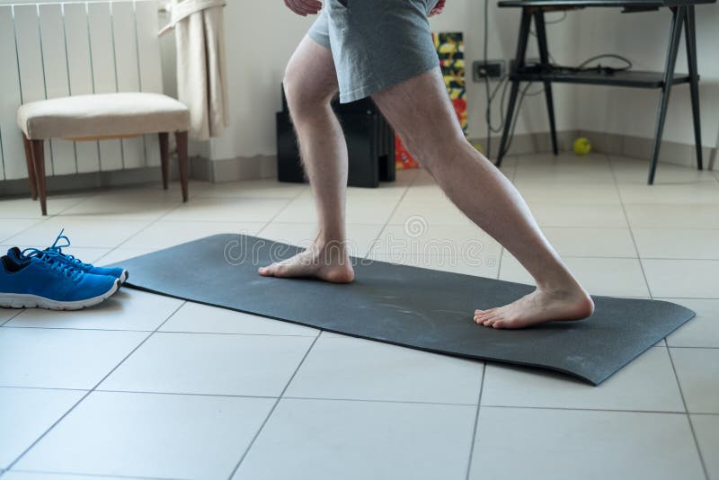 Man Doing Body Exercises and Working Out at Home Stock Image - Image of ...