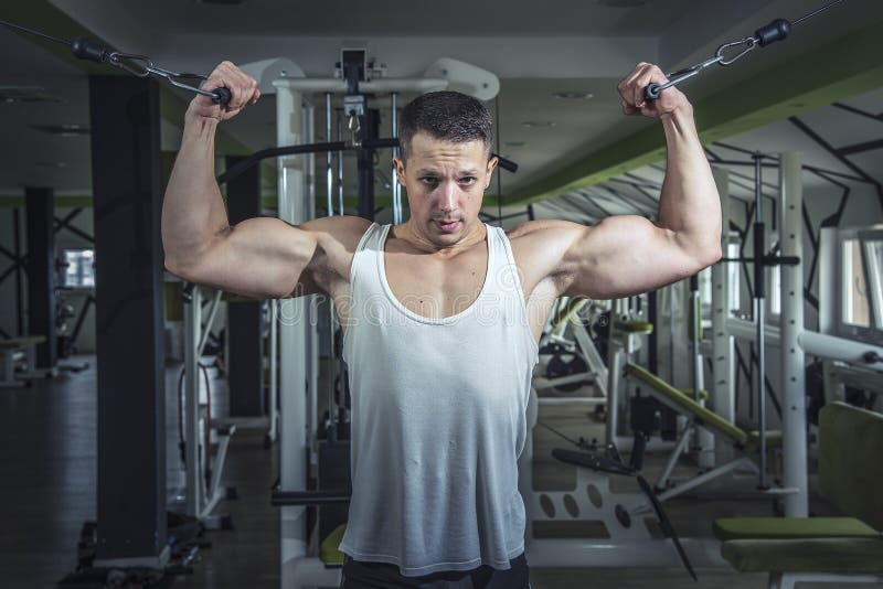 Man Doing Cable Fly Exercise in Gym Stock Image - Image of hand ...