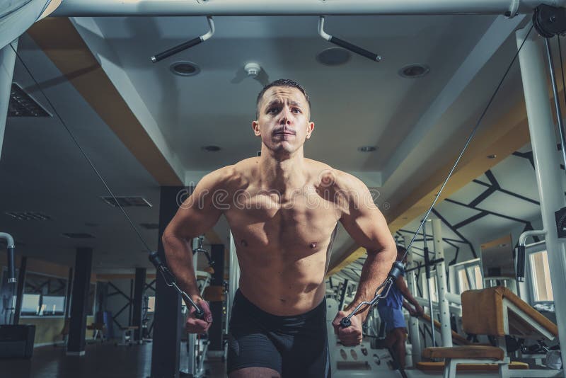 Man Doing Cable Fly Exercise in Gym Stock Photo - Image of lifting ...